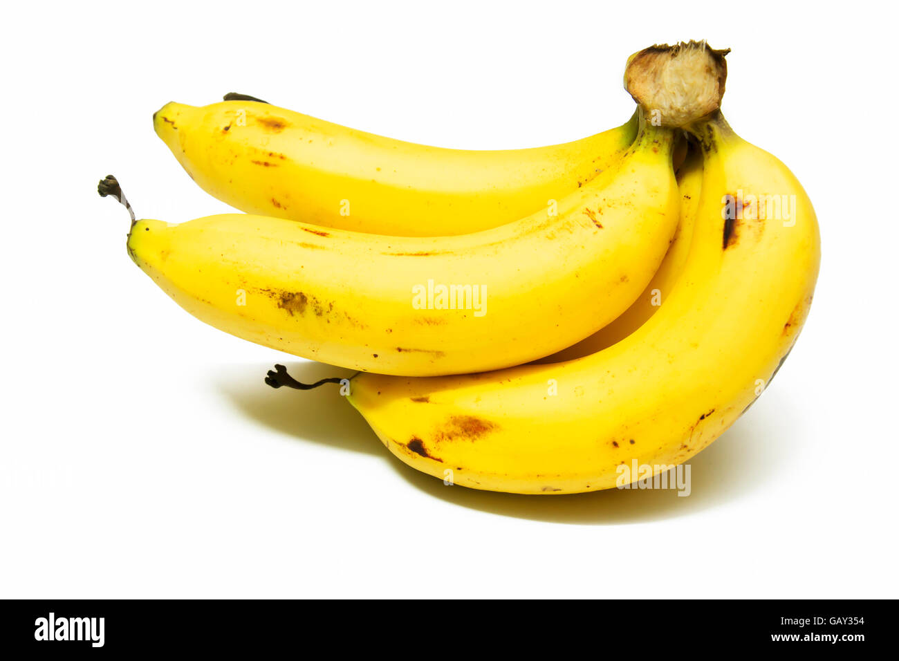 Bunch of bananas on white paper background Stock Photo - Alamy
