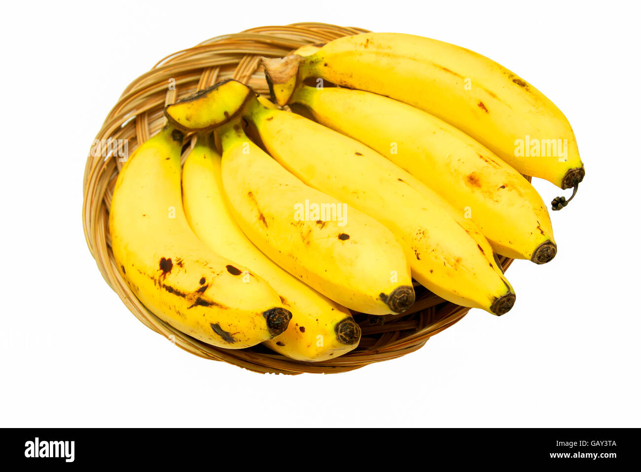 Bunch of bananas on white paper background Stock Photo - Alamy