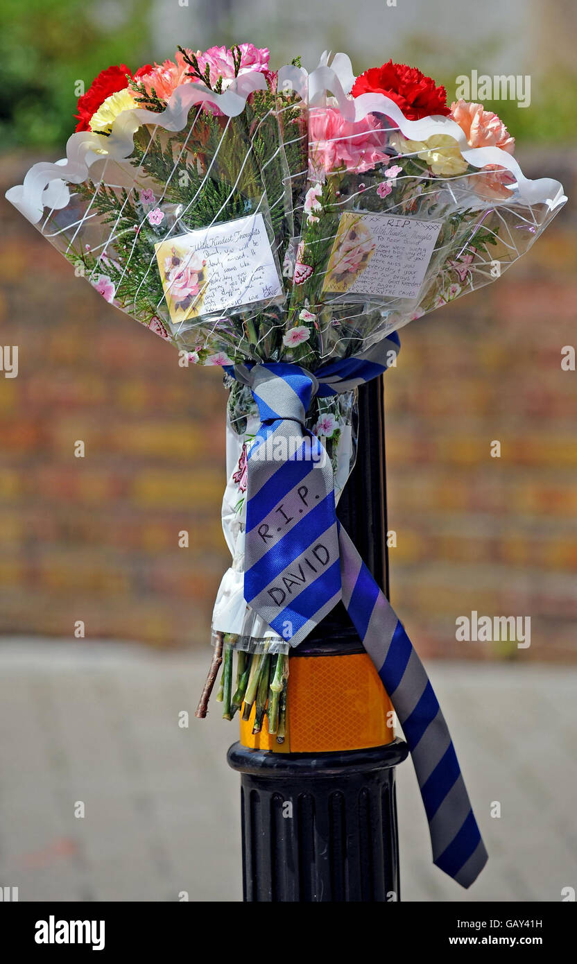 Flowers left at the scene where David Idowu was stabbed at Great Dover ...