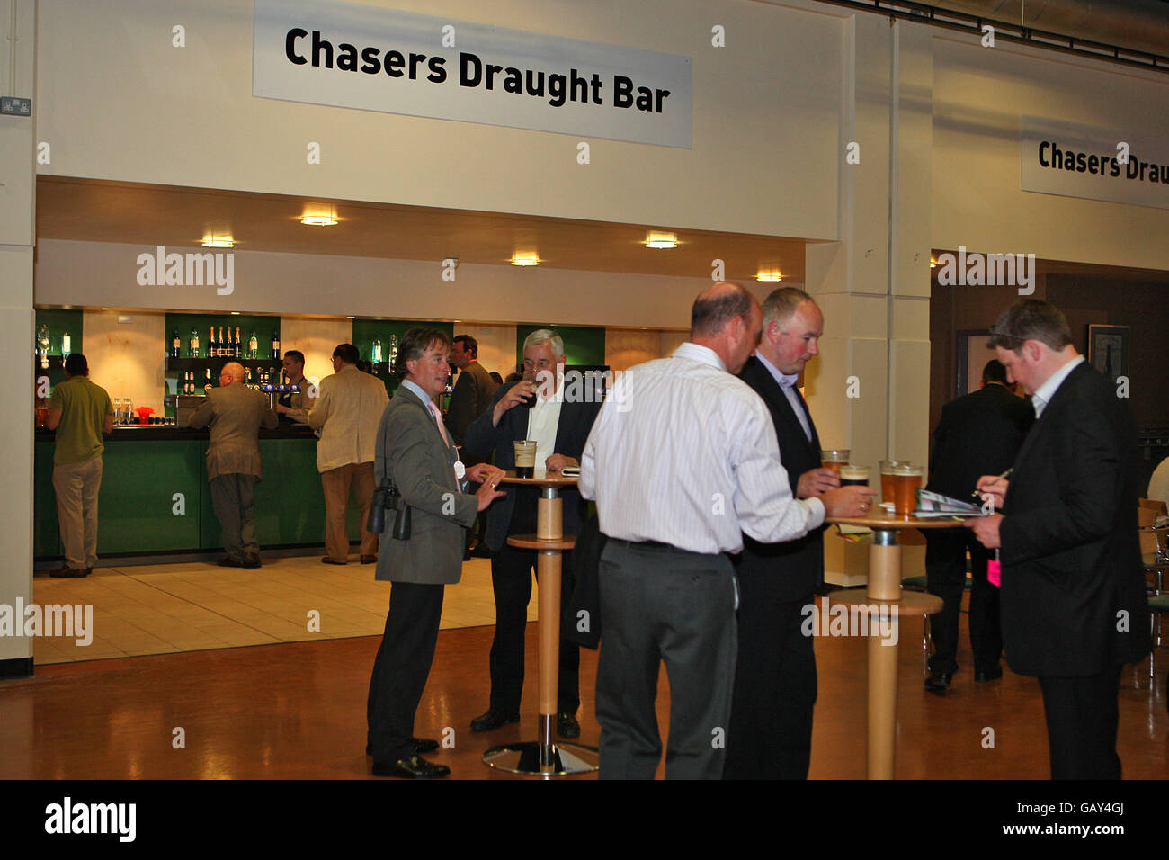Racegoers enjoy a drink at the Chasers Draught Bar, during Property Day ...