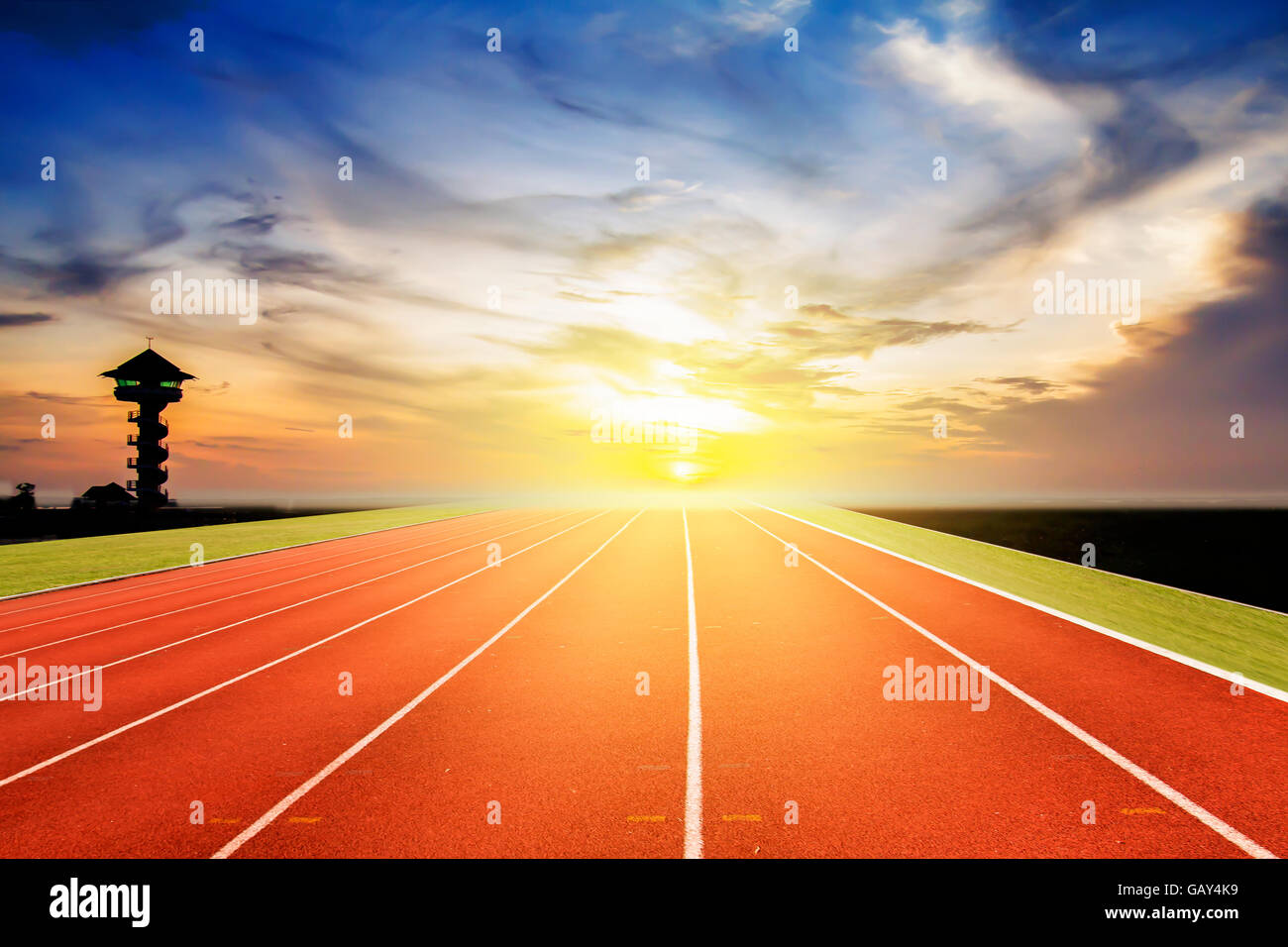 Running track ,and sunrise background Stock Photo - Alamy
