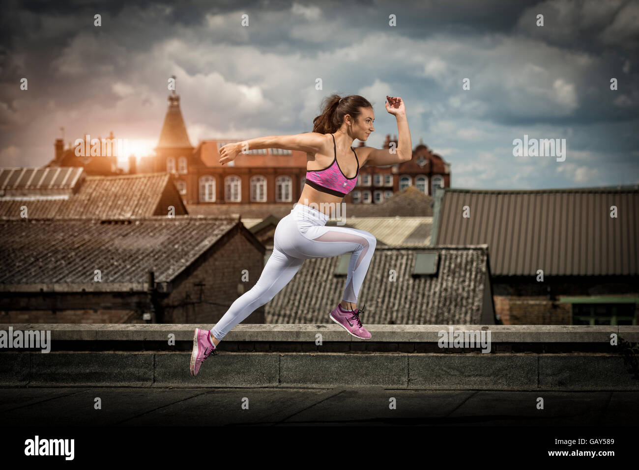 Sporty woman running Stock Photo - Alamy