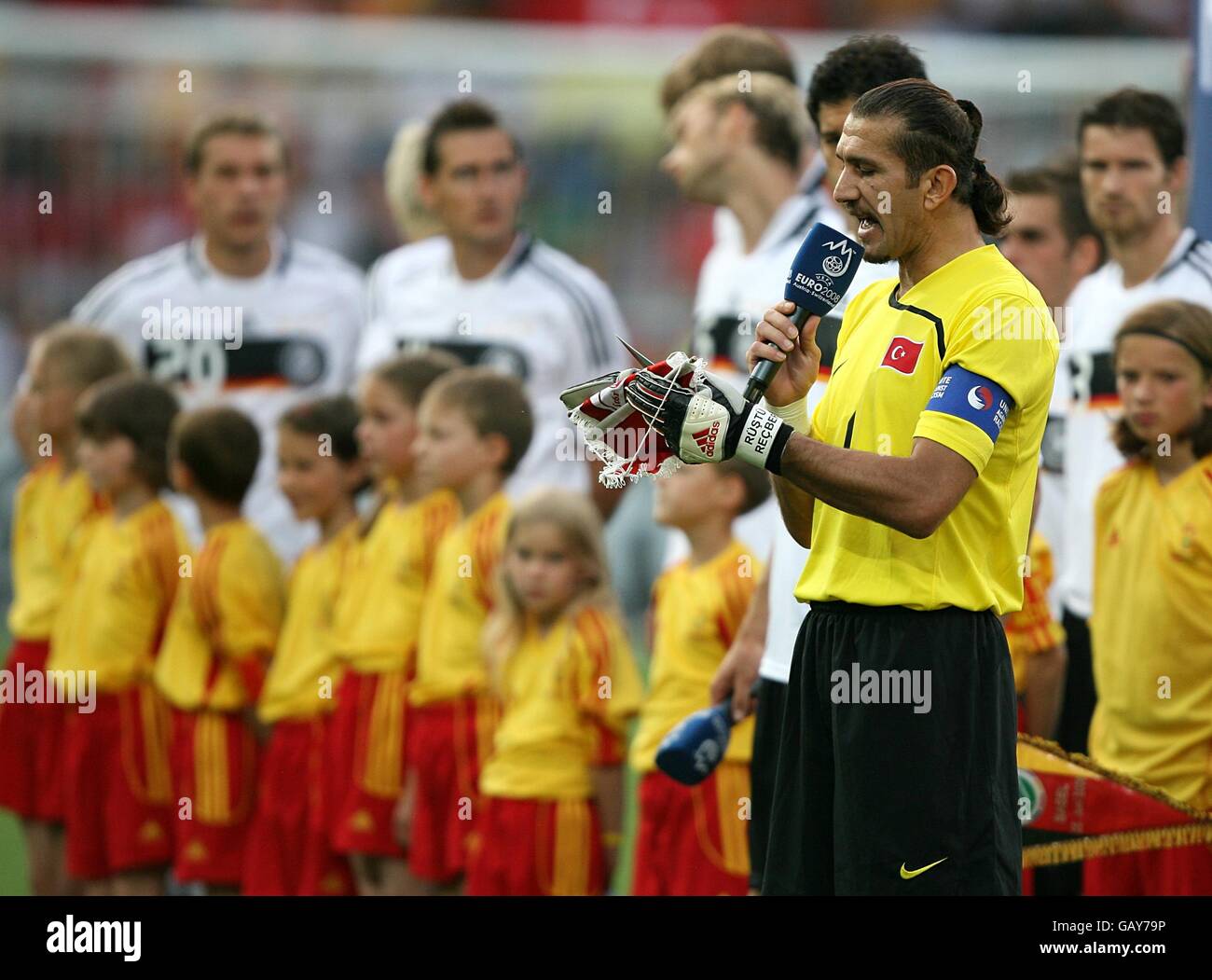 Turkey captain and goalkeeper Recber Rustu reads an anti-racism message ...