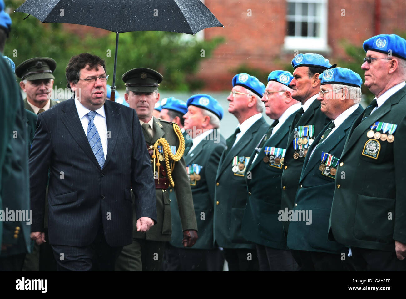 Taoiseach Brian Cowen, inspects a guard of honour of members drawn from ...