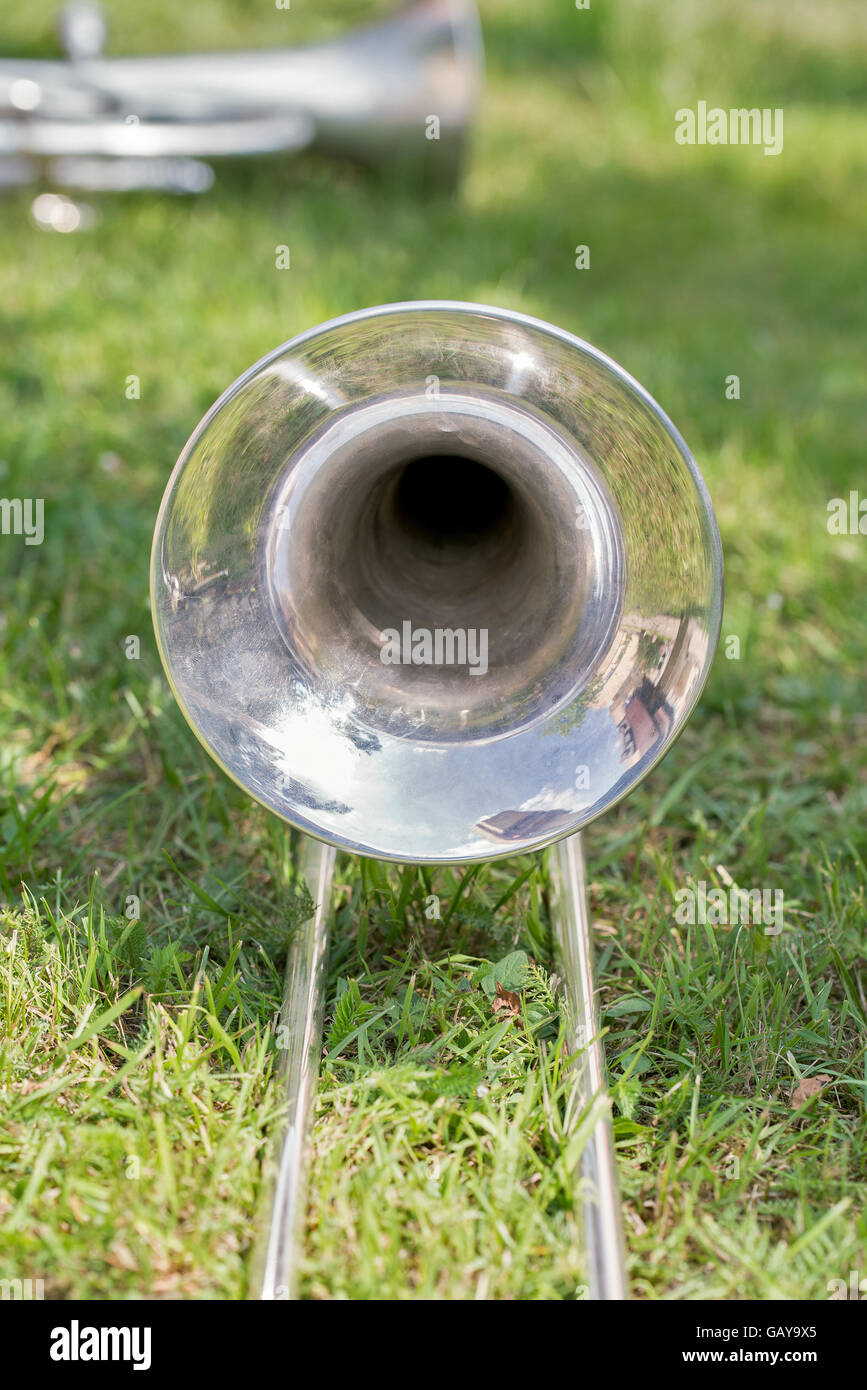 silver trombone on th grass Stock Photo - Alamy