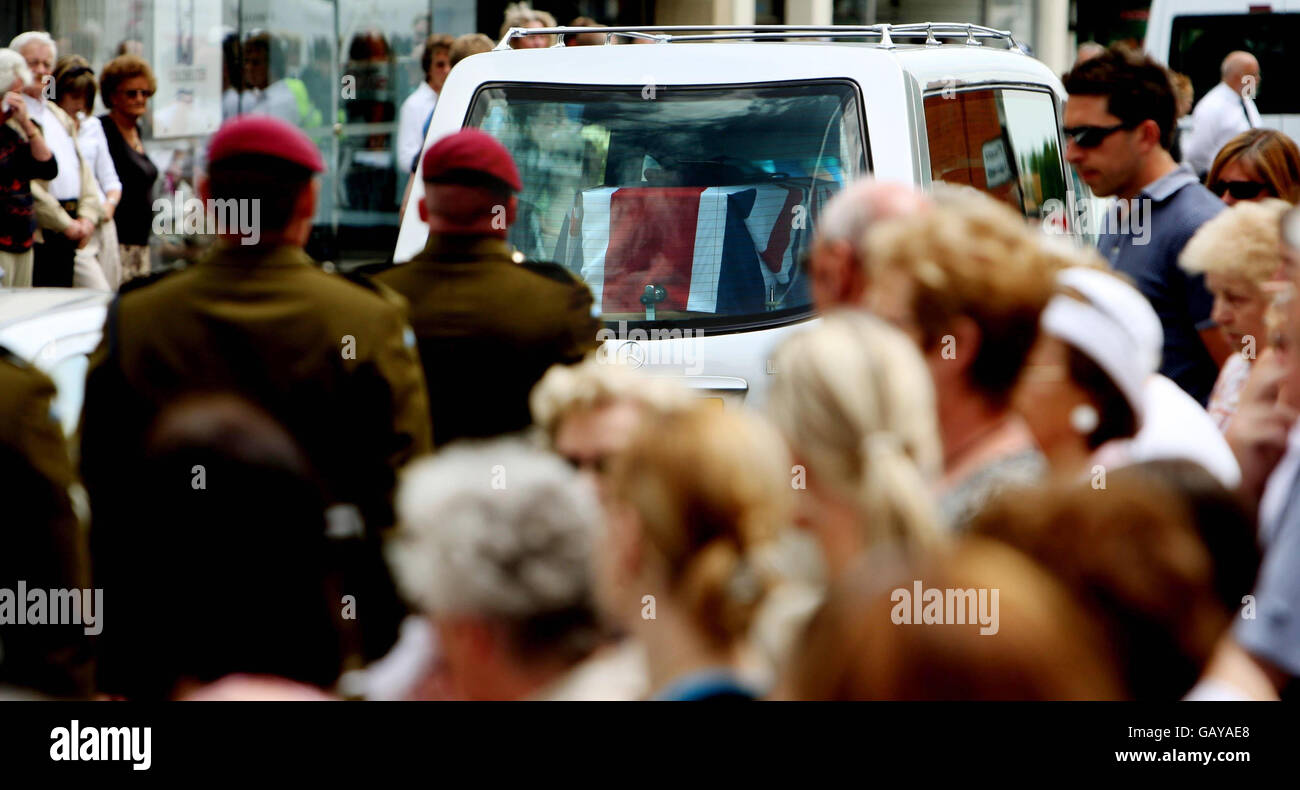 Members of the public line Colchester High Street as the funeral ...