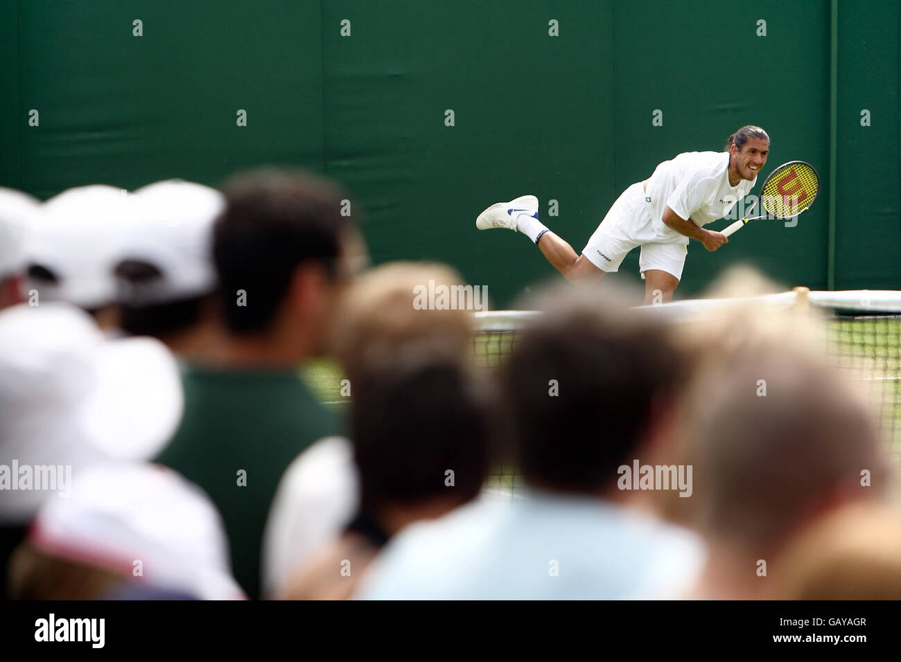 Guillermo Canas in action against Thomas Haas at Wimbledon Stock Photo ...