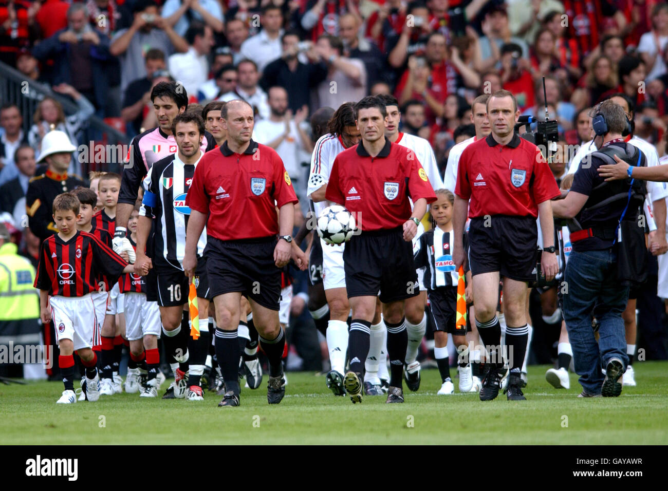 Teams and mascots walk out onto the pitch hi-res stock photography and ...