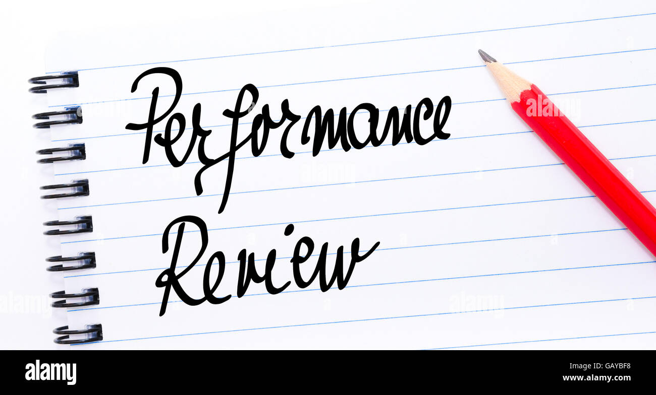 Performance Review written on notebook page with red pencil on the ...