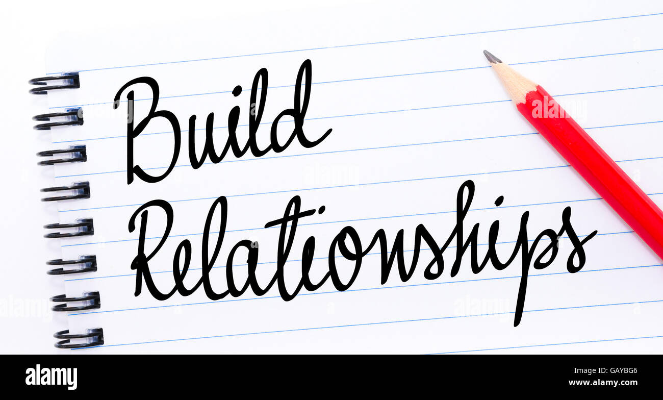 Build Relationships written on notebook page with red pencil on the ...