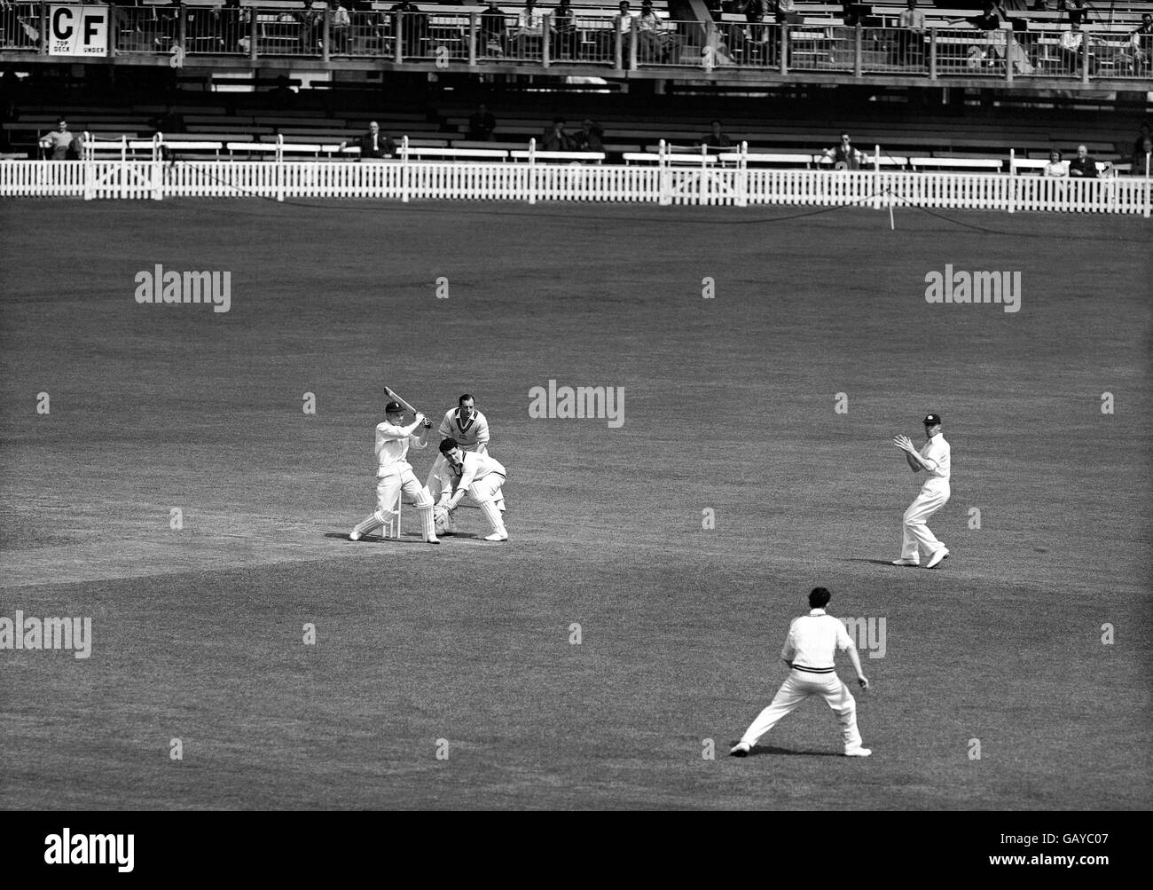 Hampshire's Alan Rayment (l) pulls the ball through the covers, watched ...