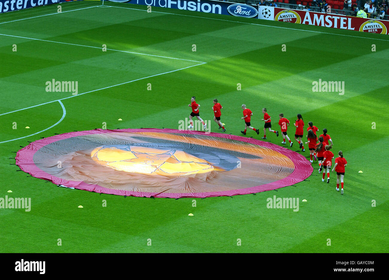 Champions league centre circle and ball boys hi-res stock photography ...