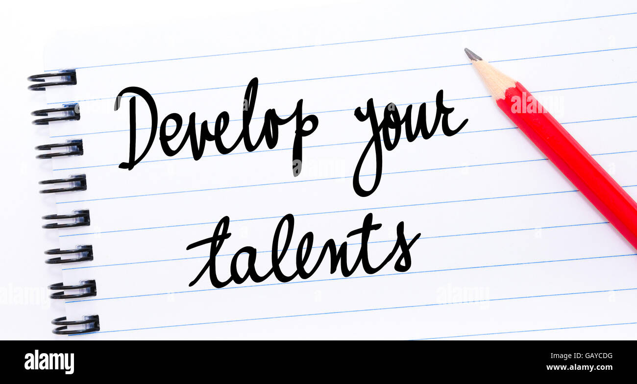 Develop Your Talents written on notebook page with red pencil on the ...