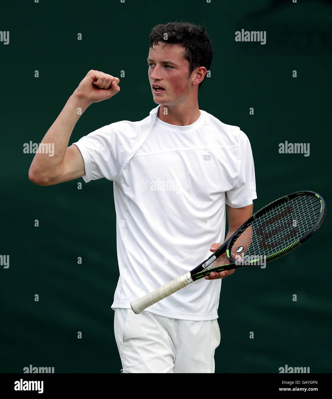 Ewan Moore takes on Ulises Blanch in the boys singles on day eight of ...