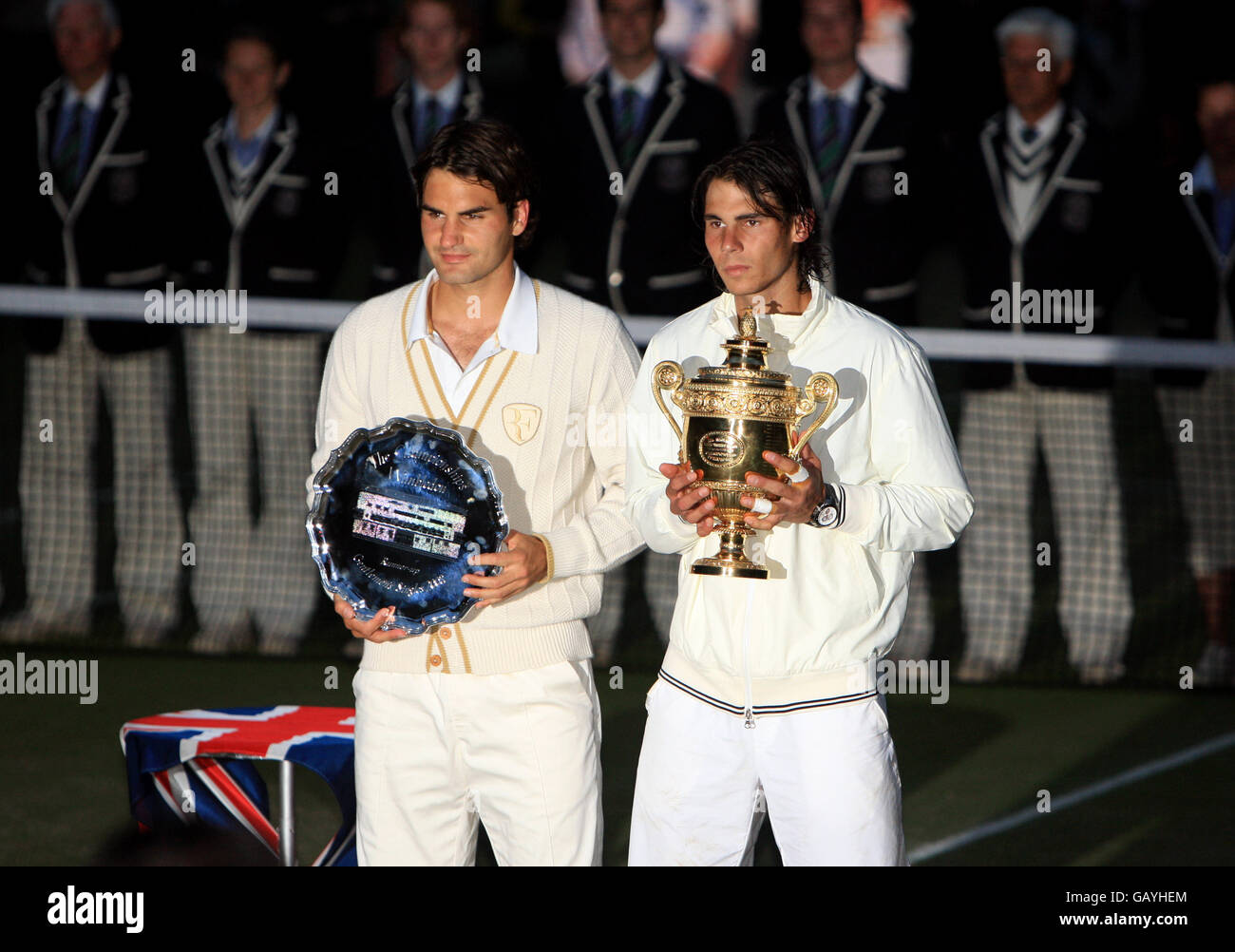 Rafael Nadal (right) with his winners trophy and Roger Federer with his ...