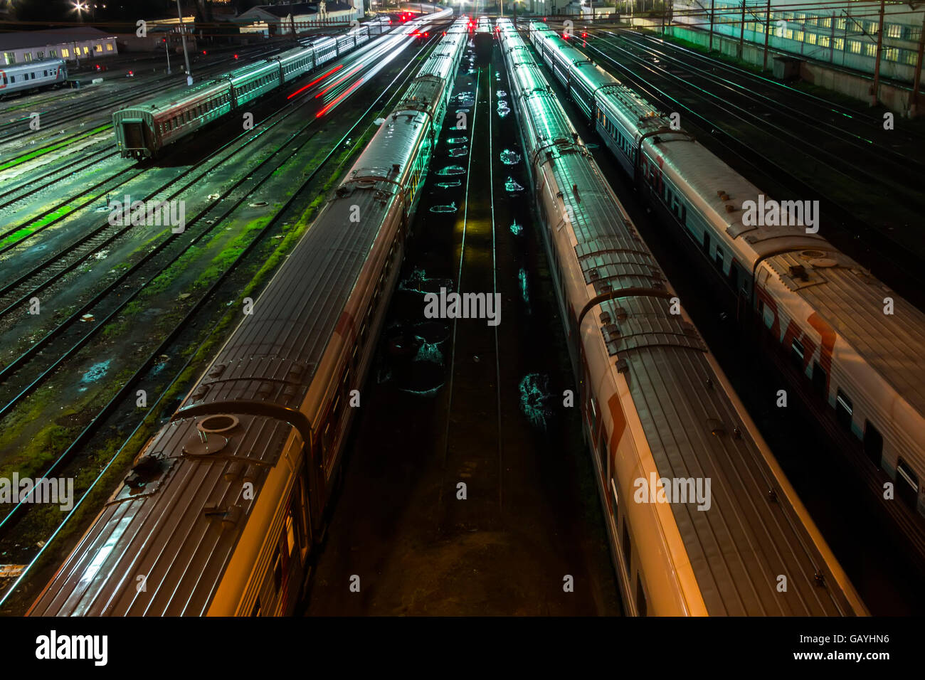 trains in railway junction at night Stock Photo - Alamy