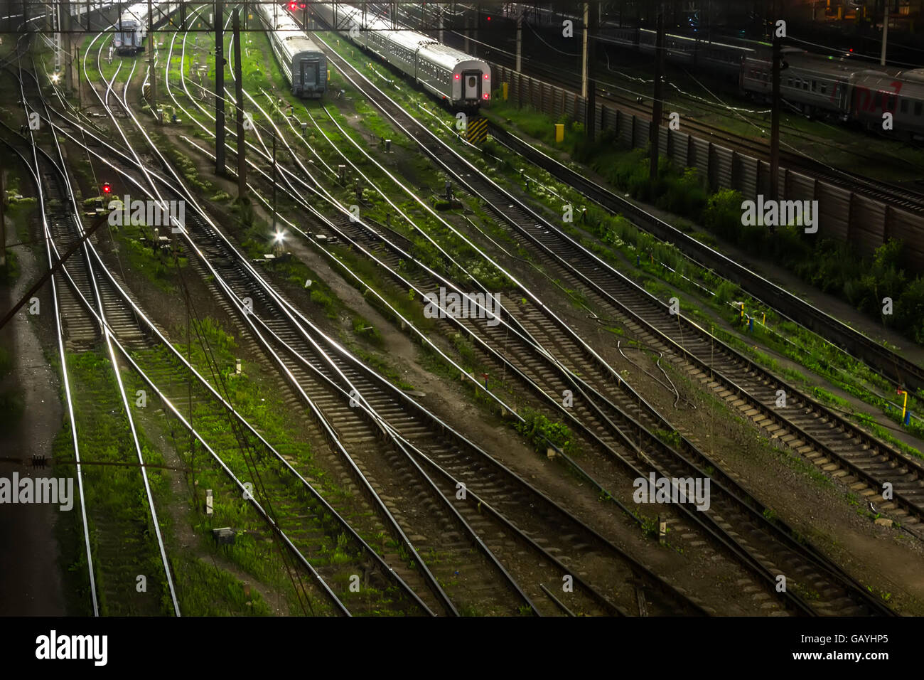 trains in railway junction at night Stock Photo - Alamy