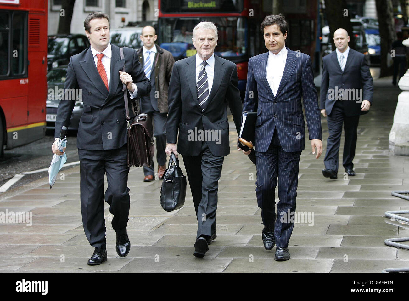 FIA President Max Mosley (centre) arrives at London's High Court this ...