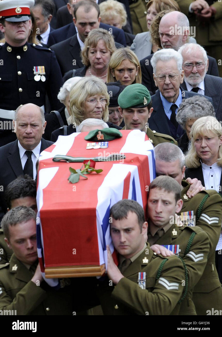 Cpl Carl Bryant (centre) is flanked by Des (left) and Maureen Feely ...