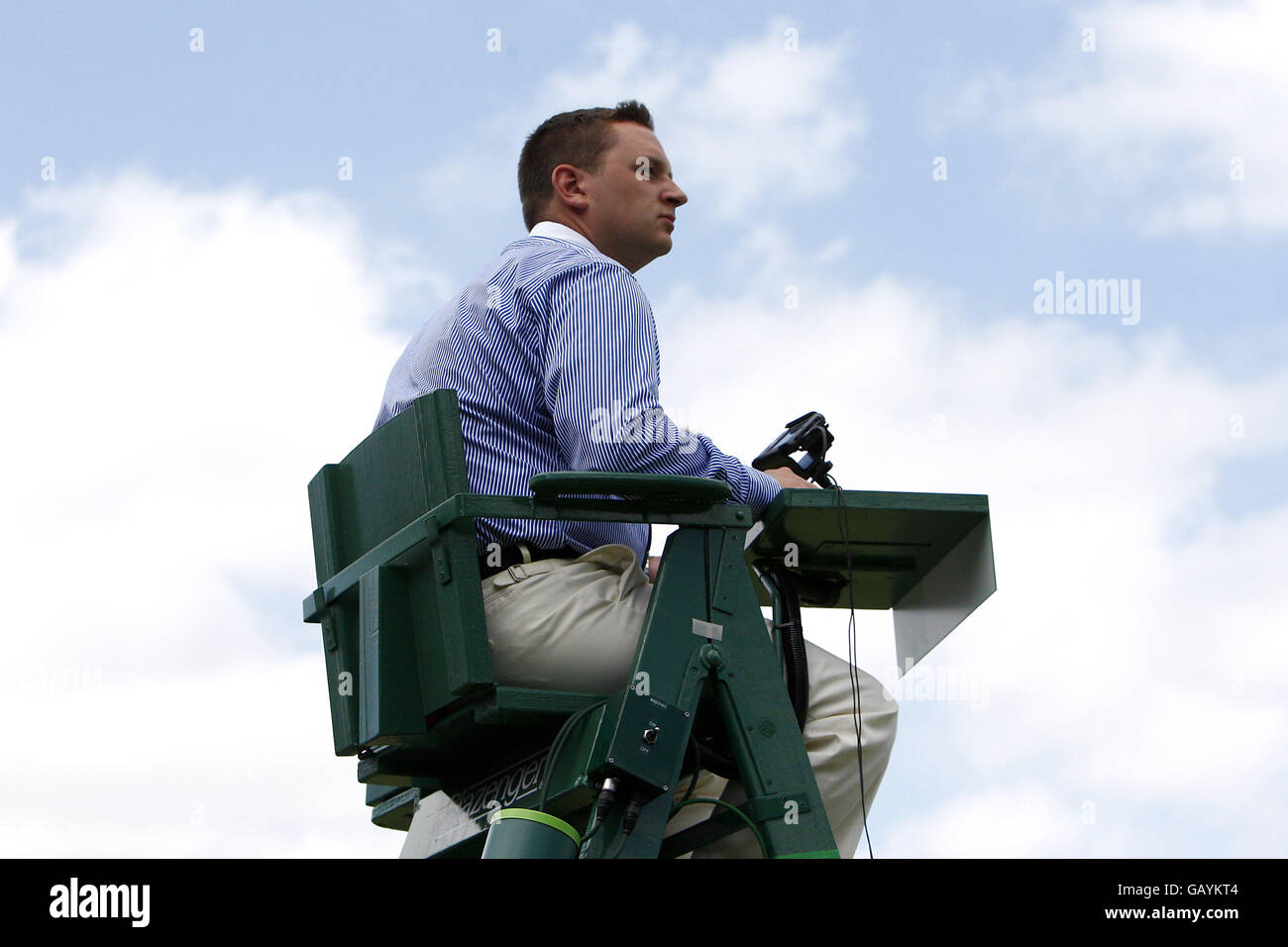 An umpire oversees the action at the Wimbledon Championships 2008 at ...