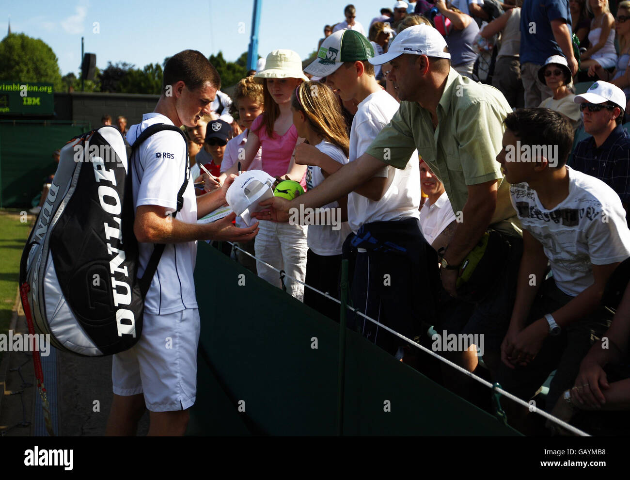 Great Britain's Jamie Murray signs autographs during the Wimbledon ...