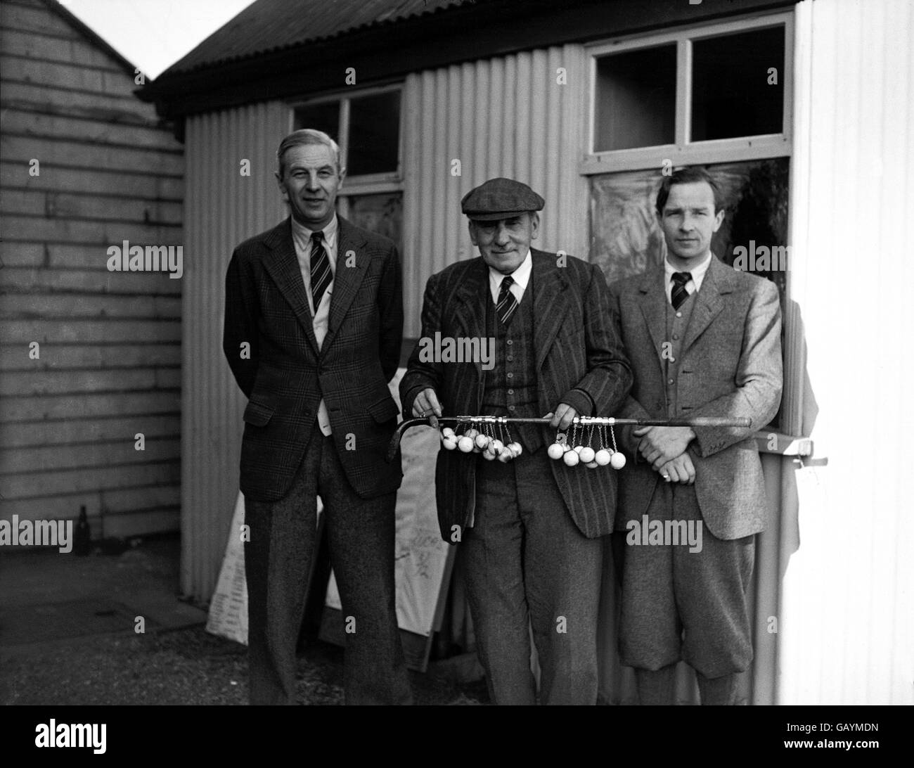 Bernard Darwin (c) is flanked by the winner of the tournament, PB Lucas ...