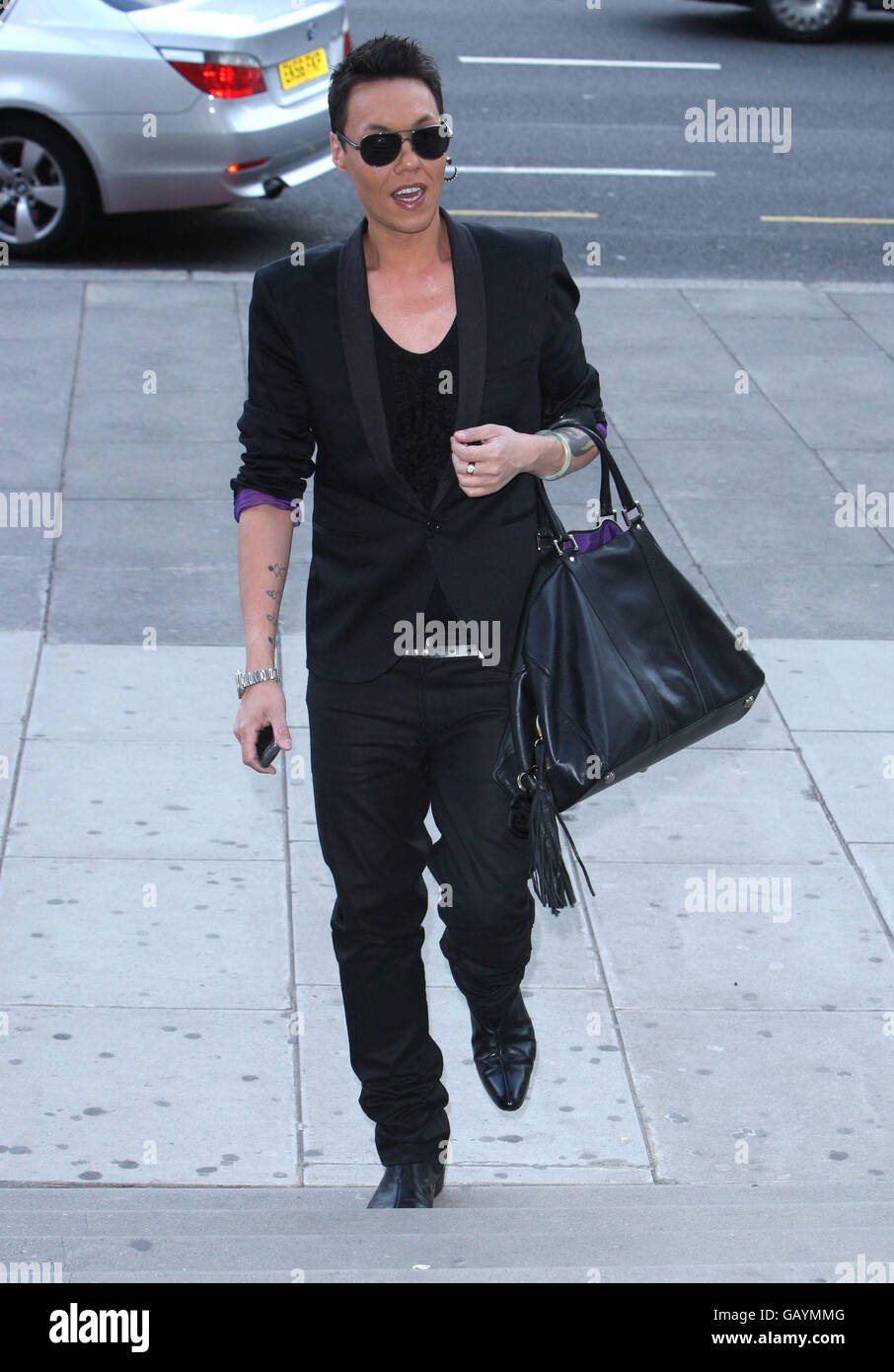 Gok Wan arriving at the Harper Collins summer party for distinguished ...