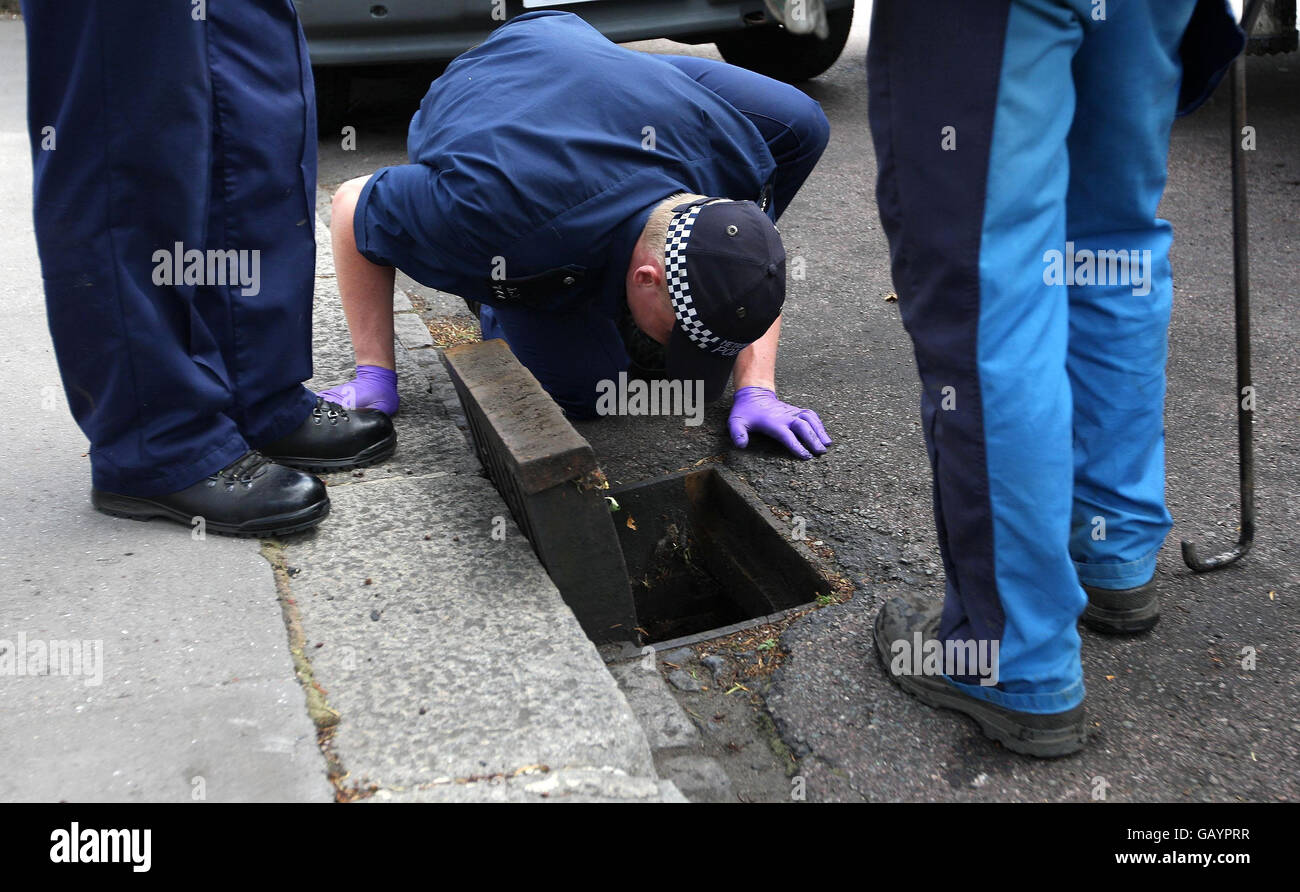 Police carry out an investigation at the scene where 16-year-old ...