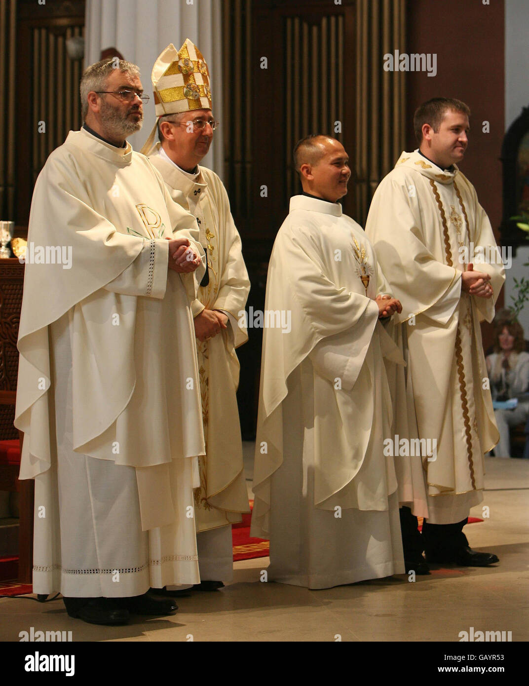 Archbishop of Dublin ordains three new priests Stock Photo - Alamy