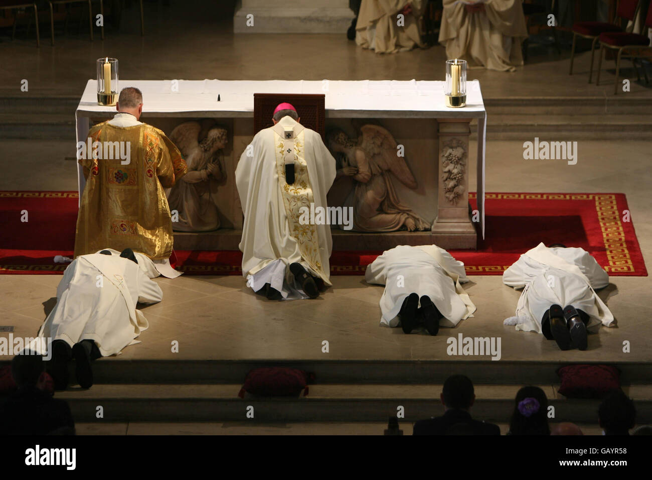 Archbishop of Dublin ordains three new priests Stock Photo - Alamy