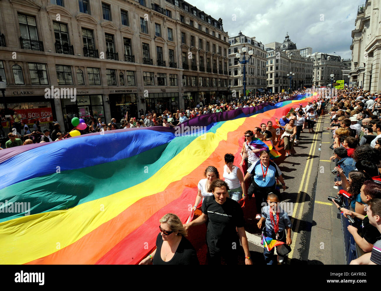 Revellers take part in the Pride London parade on Regent Street in ...