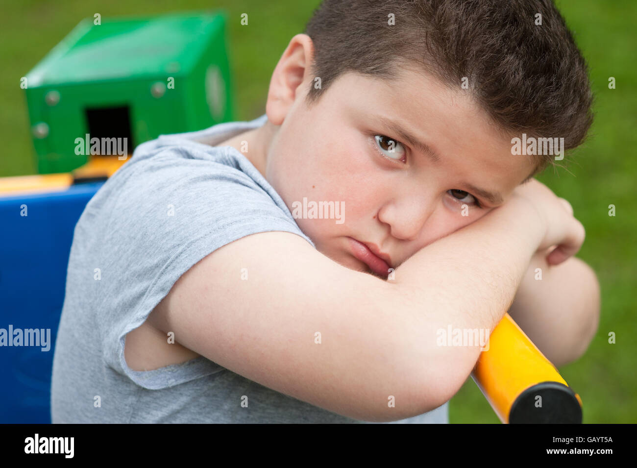 tired sad fat boy sitting on a fitness equipment Stock Photo - Alamy