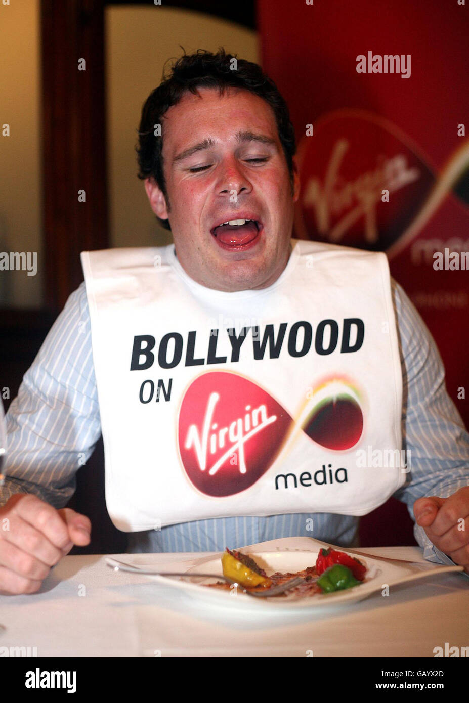 Student Toby Steele eats the 'Bollywood Burner', which is an attempt to ...