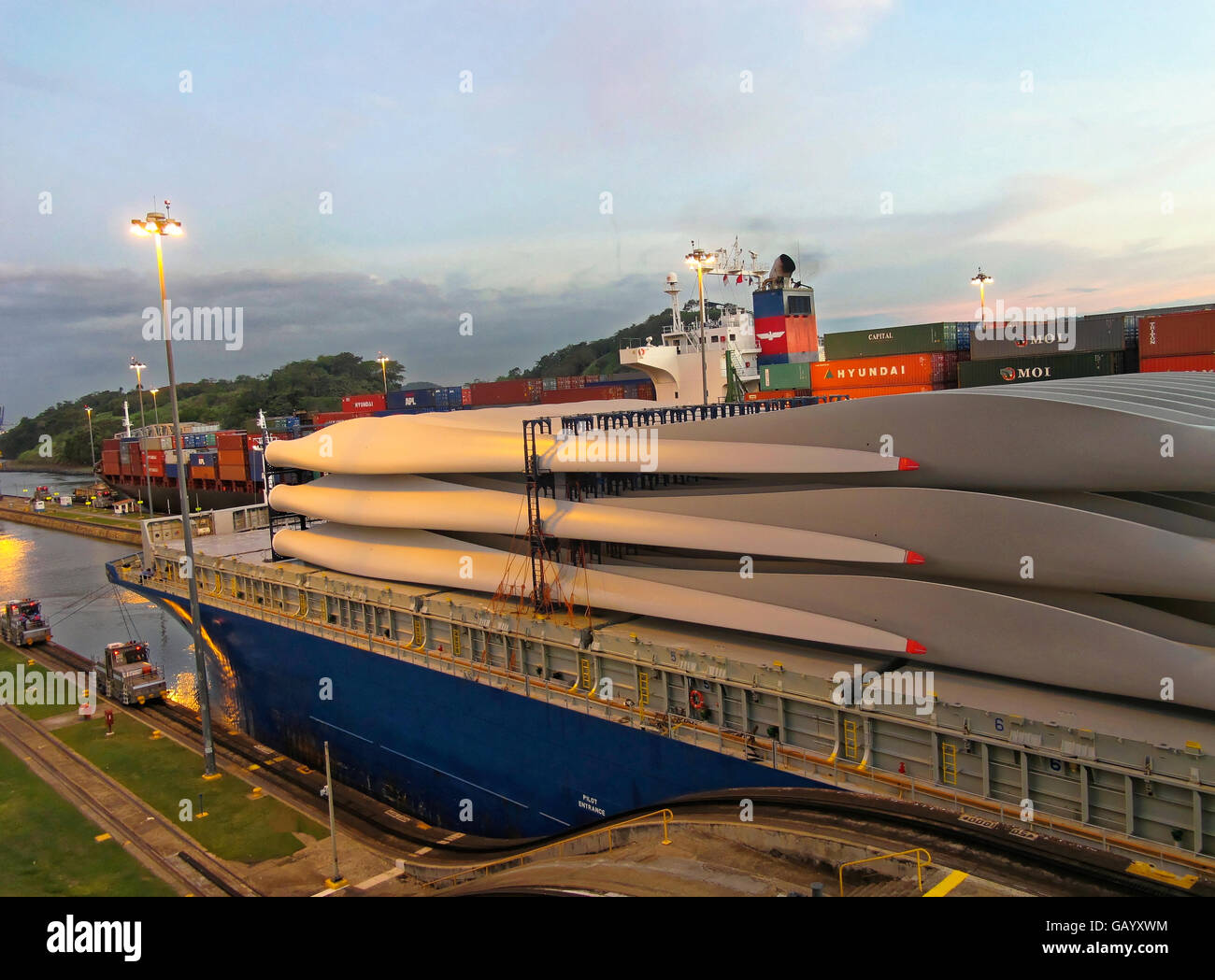 Large cargo ship carrying wind turbine arms going through the ...