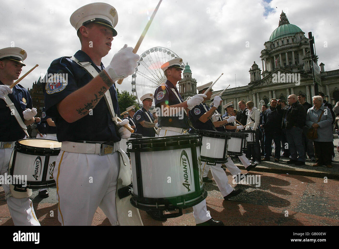 The Orange Order march past City Hall in Belfast to lay a wreath at the ...