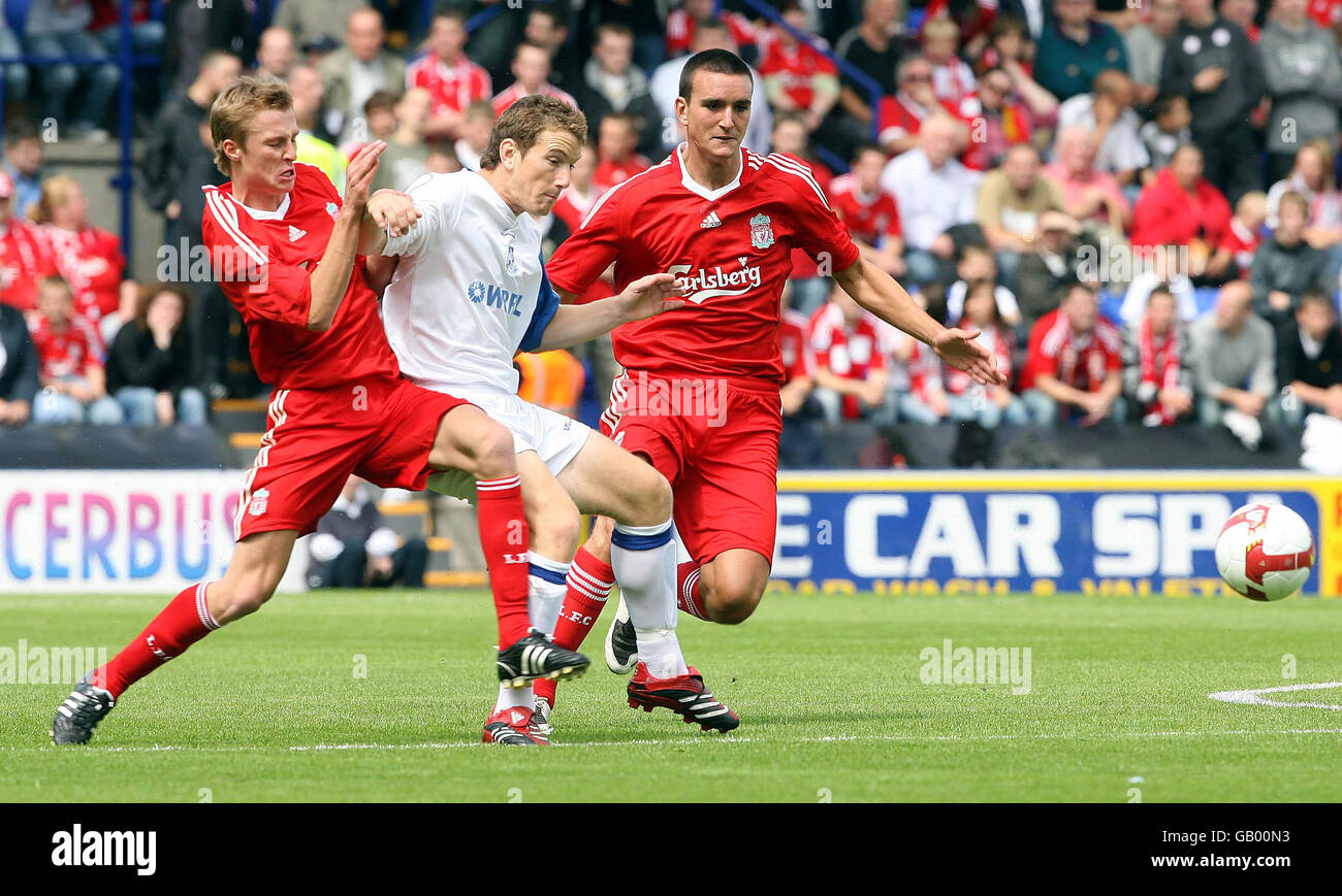 Liverpool's Stephen Derby (Left) and Jack Hobbs (right) challenge ...