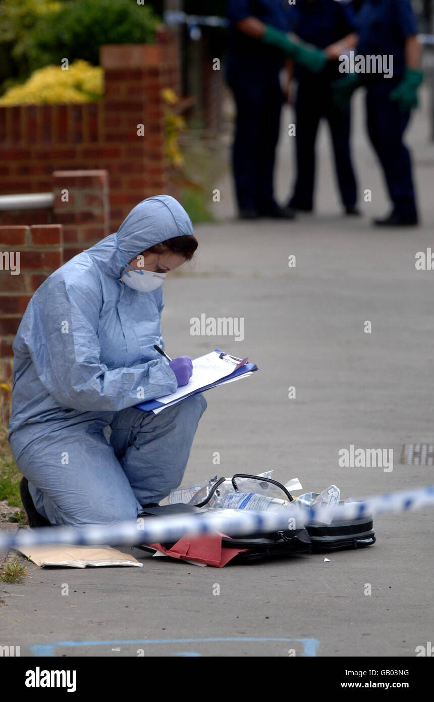 A police forensic officer at the scene where 16-year-old Shakilus ...