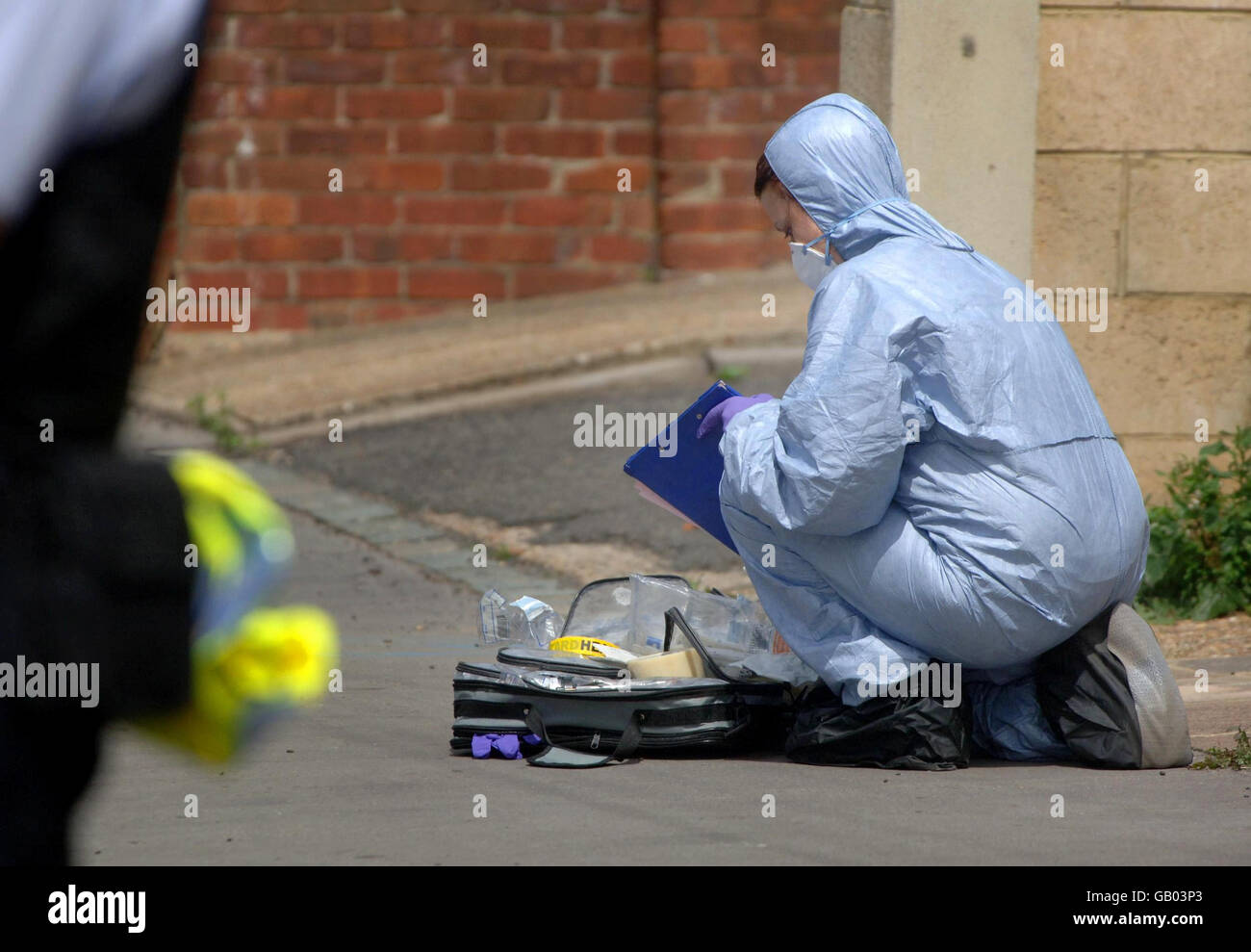 A police forensic officer at the scene where 16-year-old Shakilus ...