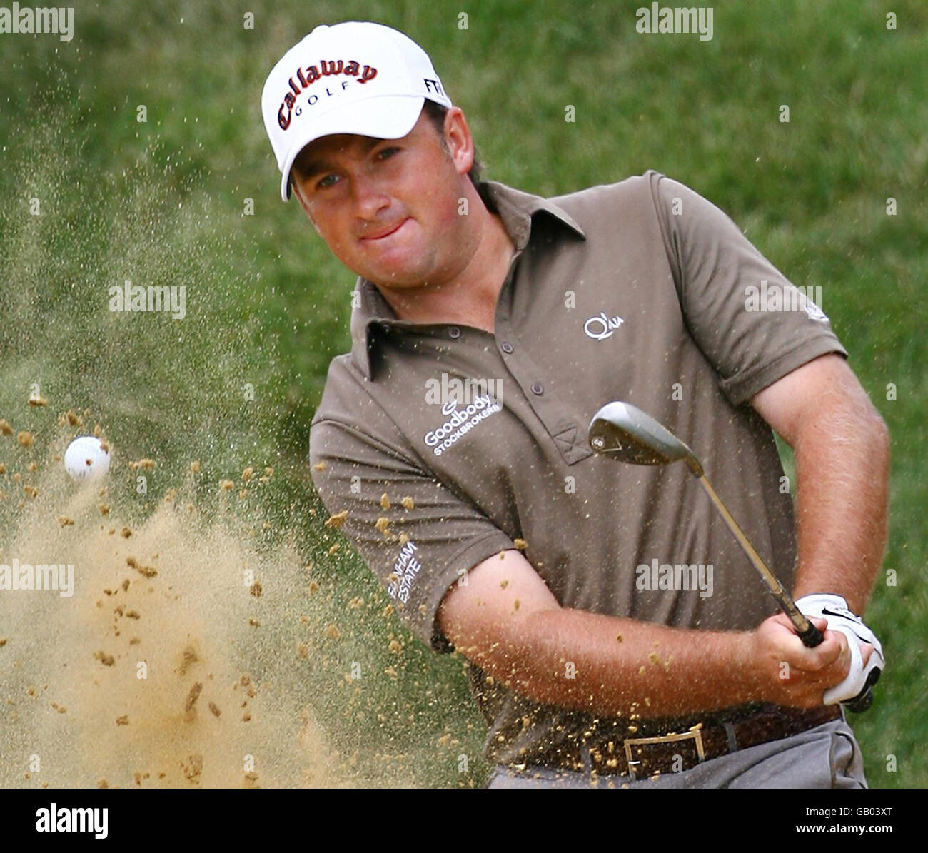 Graeme McDowell plays from a bunker on the 8th green during the ...