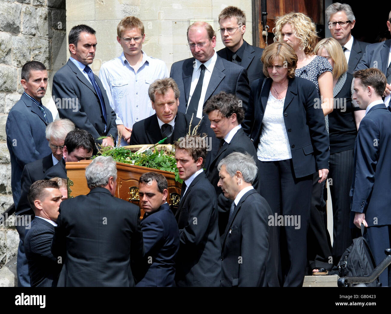 Family members watch as the coffin of Sean Reeve leaves St Joseph's ...