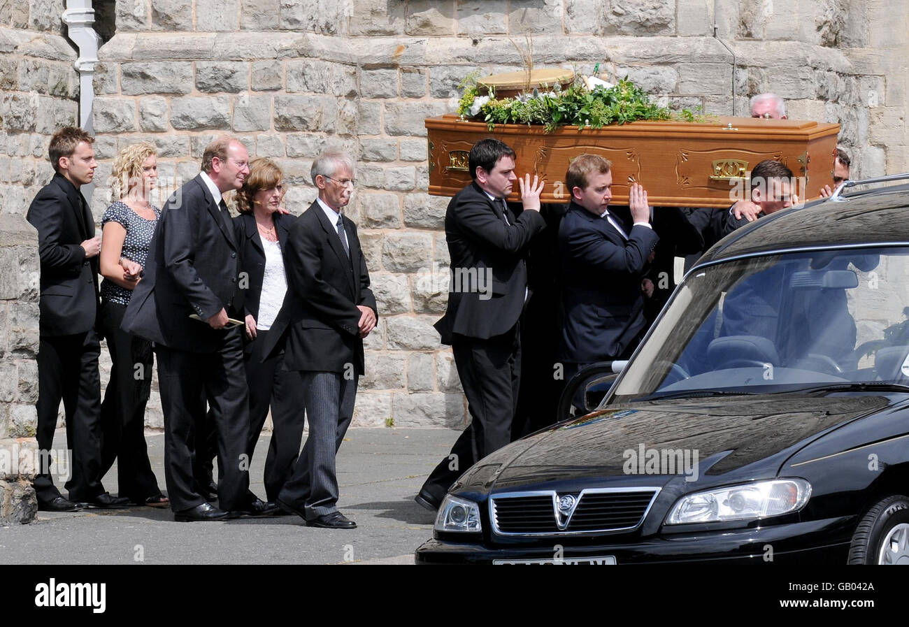 Family members follow the coffin of Sean Reeve following his service at ...