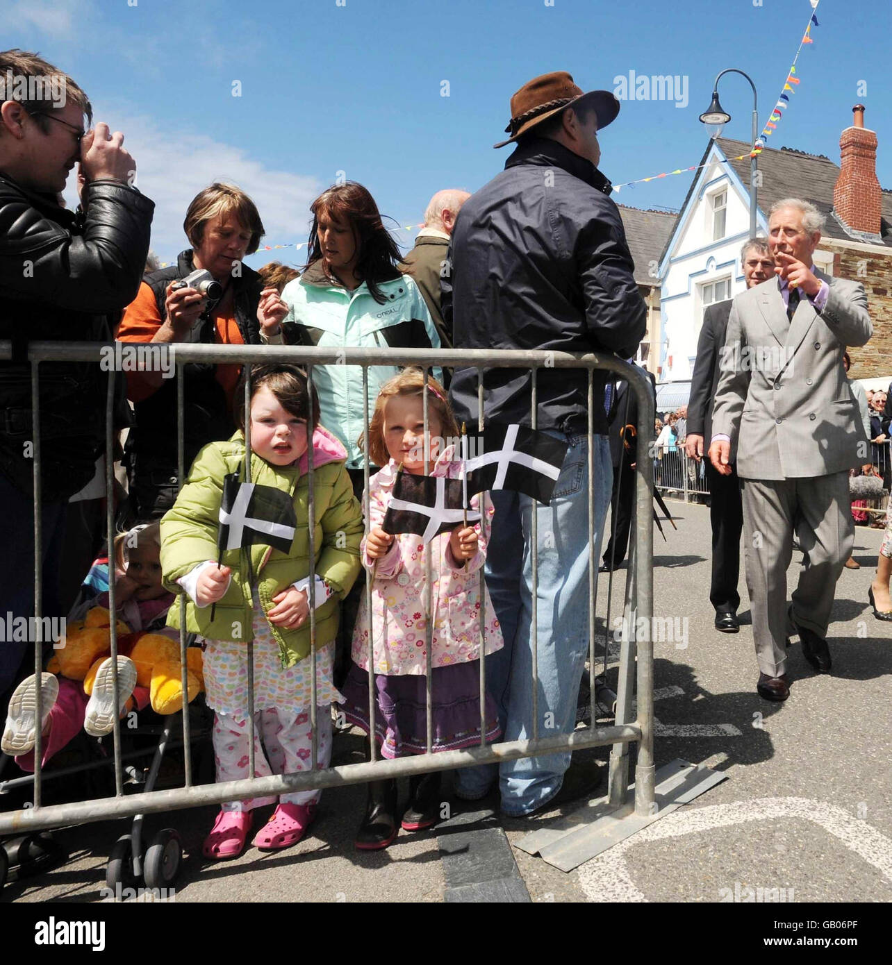 Lucy Haynes (left), 3, and Hannah Slade, 3, both from Tintagel, wave ...