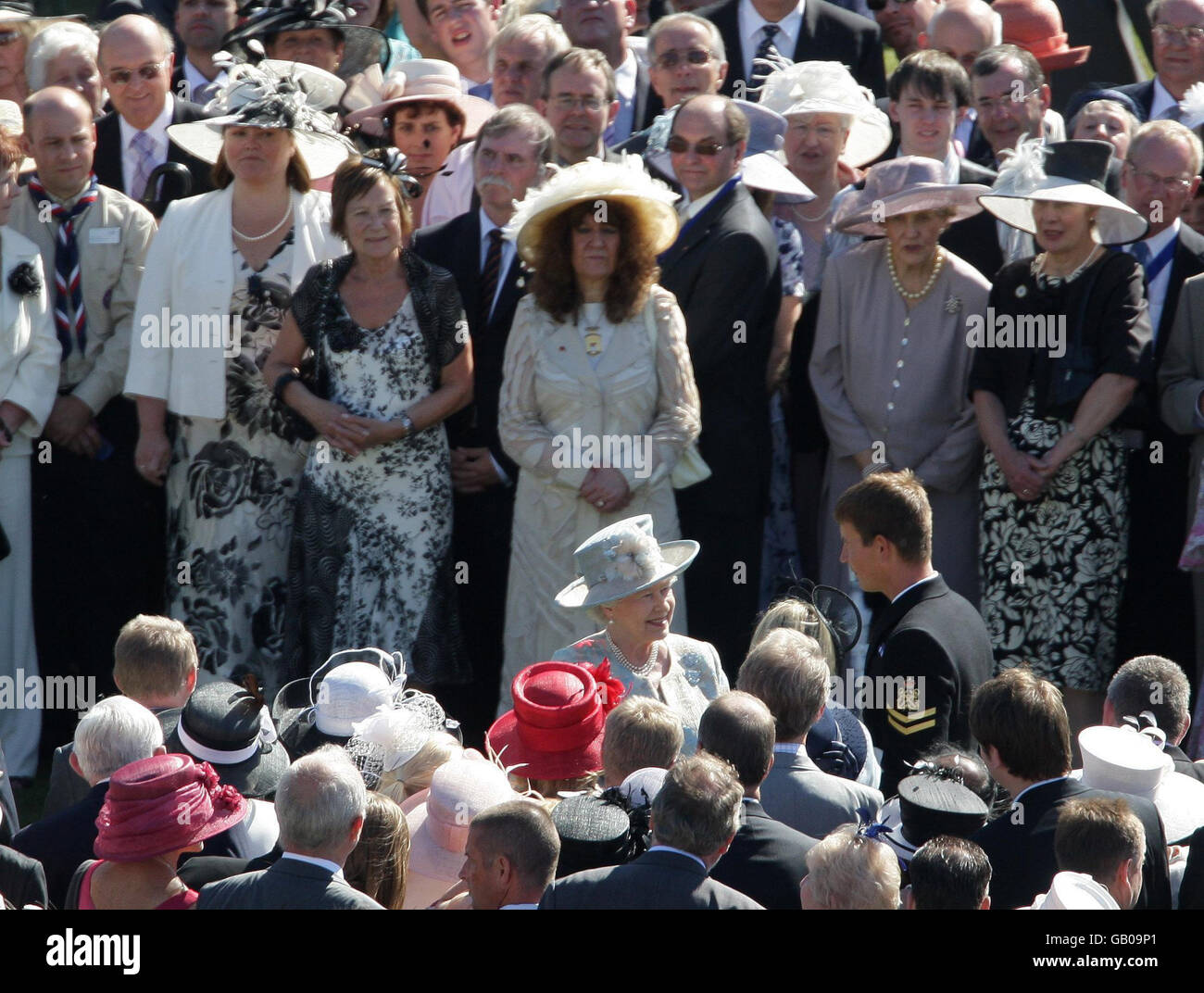 Britain's Queen Elizabeth II greets guests at one of this year's Royal ...