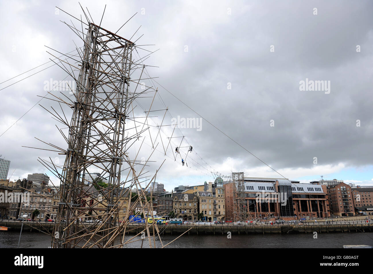 Workmen begin constructing a 100m Bamboo bridge which will span the ...
