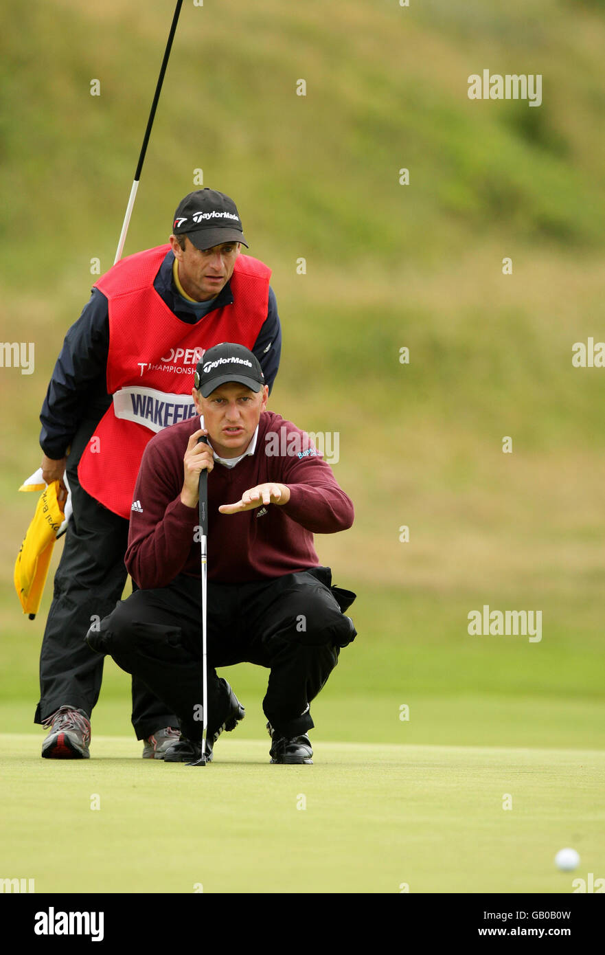 Full length squatting watching club england mangrk hi-res stock ...