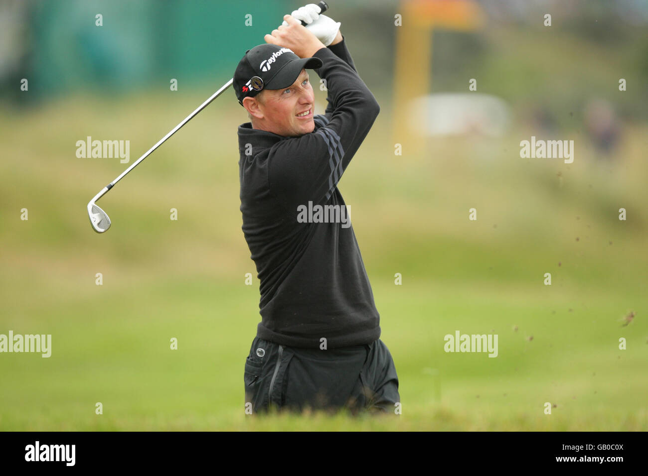 England's Simon Wakefield plays a shot out of a bunker on the 10th hole ...