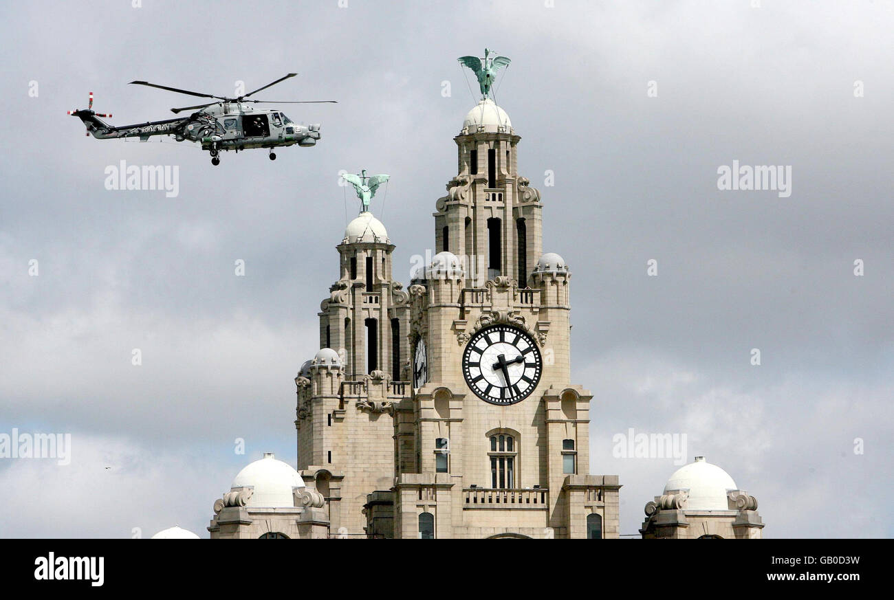 A Royal Navy helicopter flies past the Liver building during the Tall ...
