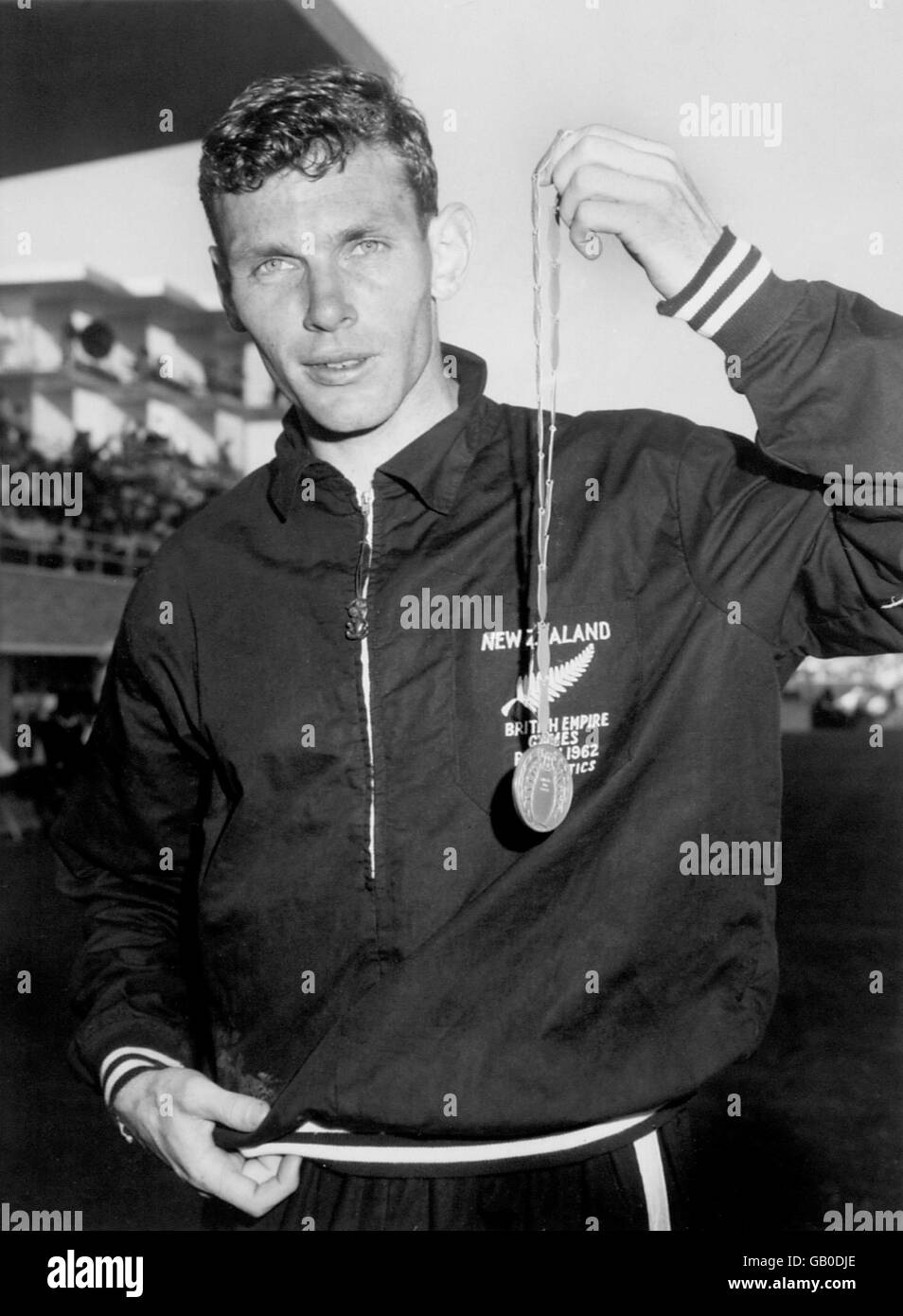 New Zealand's Peter Snell shows off the gold medal he won in the men's ...