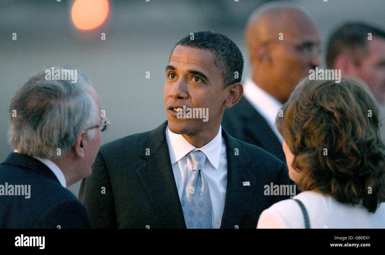 US senator Barack Obama (centre) speaks with US ambassador Robert ...