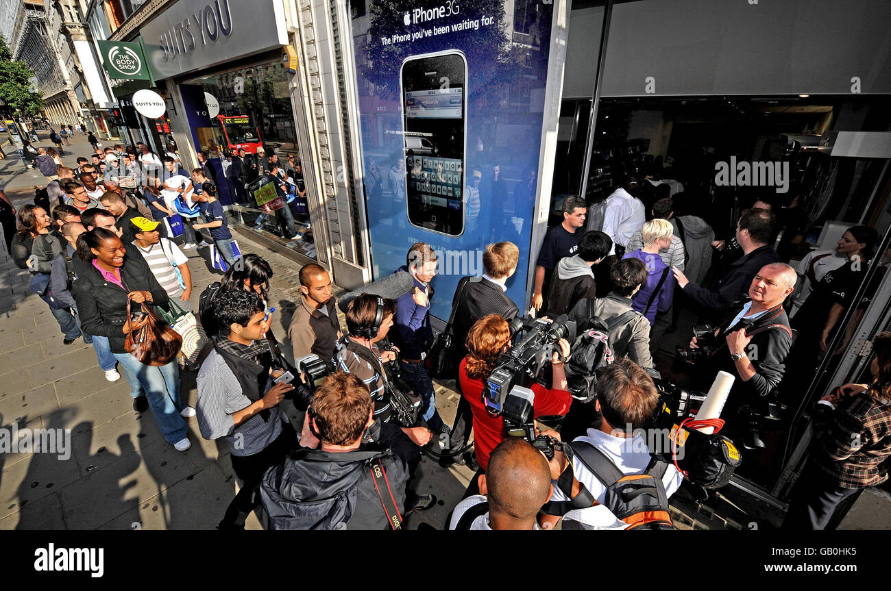The first customers enter the 02 store on Oxford Street in London, as ...